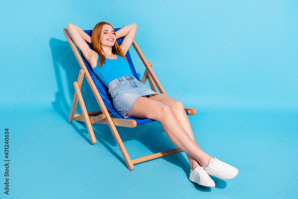 Portrait of attractive dreamy cheerful girl sitting in chair pool party ...