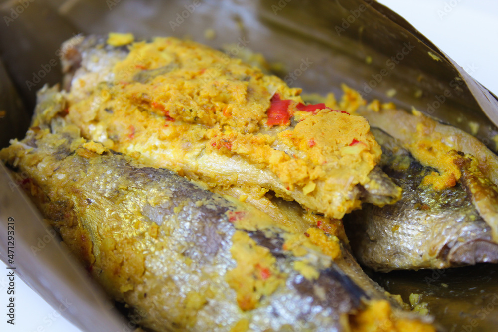 Pepes ikan, or steamed fish with herbs then wrapped in banana leaf ...