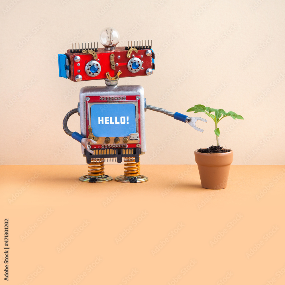 Artificial intelligence and nature. Smiling robot pulls his hand ...