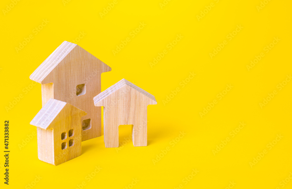 Residential buildings on a yellow background. Buying and selling real ...
