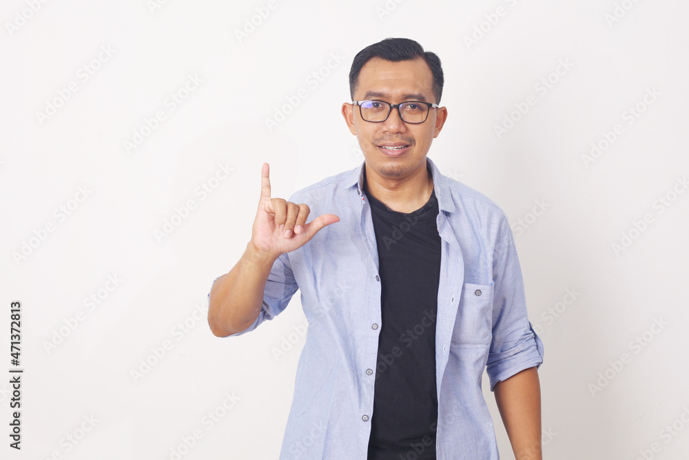 Asian man demonstrating the letter Y. sign language symbol for deaf ...
