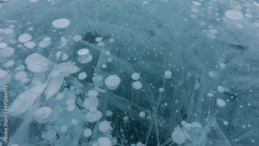 Transparent turquoise ice. Full screen. Close-up. Top view ...