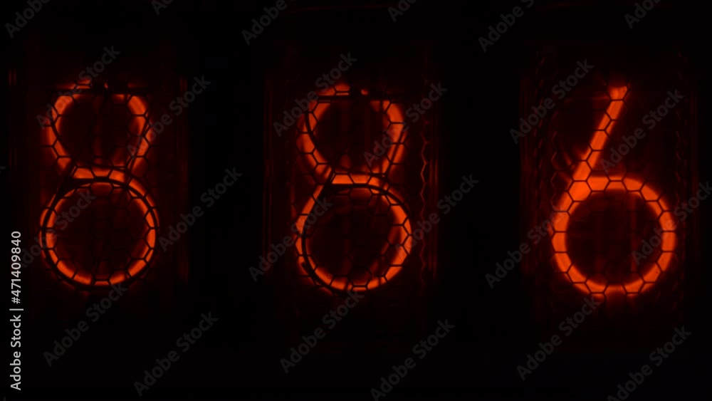 Retro vacuum tube display on the device counts seconds. Displaying ...