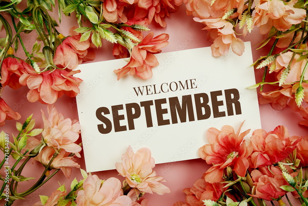 Welcome September typography text with flowers frame on pink background ...