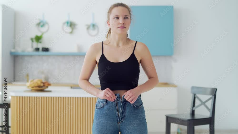 Young fat woman cannot wear small pants after gaining weight. An ...