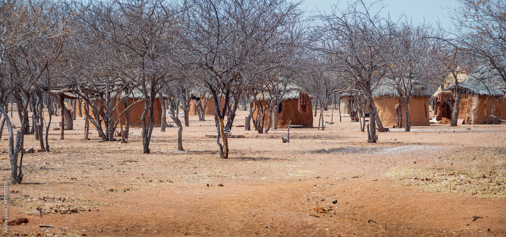 Round wooden huts in the village of Himba tribe, Namibia. Traditional ...