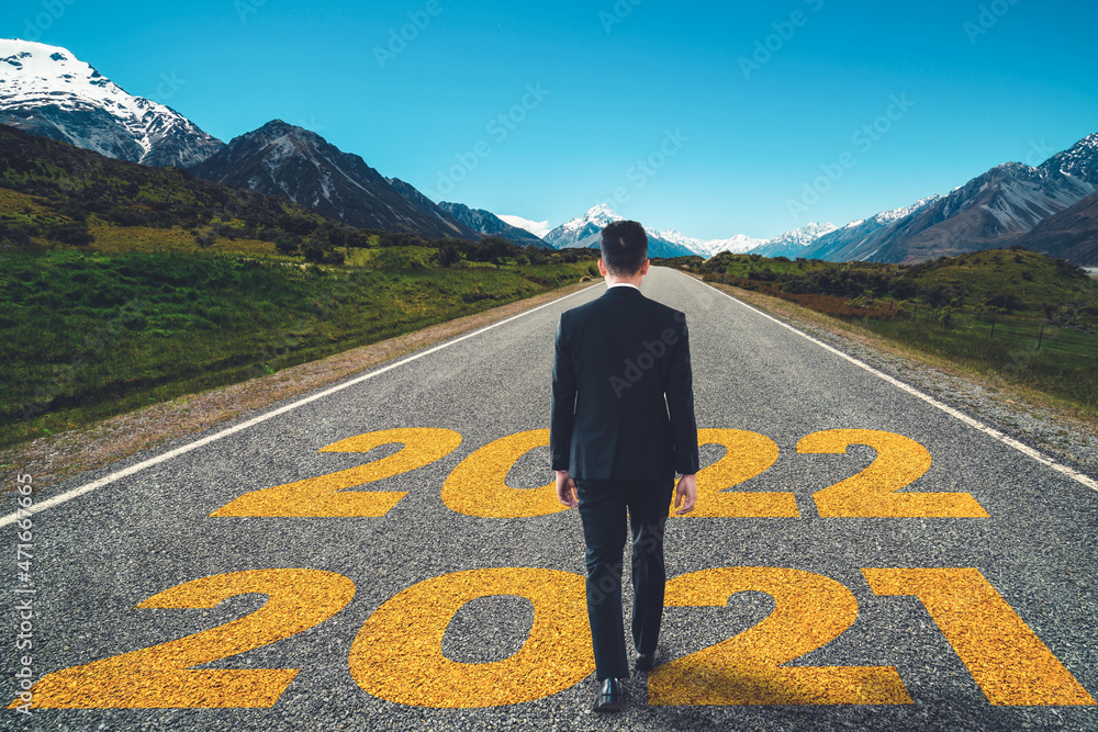 The 2022 New Year journey and future vision concept . Businessman ...