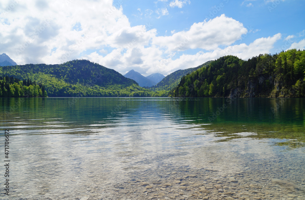 gorgeous emerald-green lake Alpsee in the German Alps in Schwangau near ...