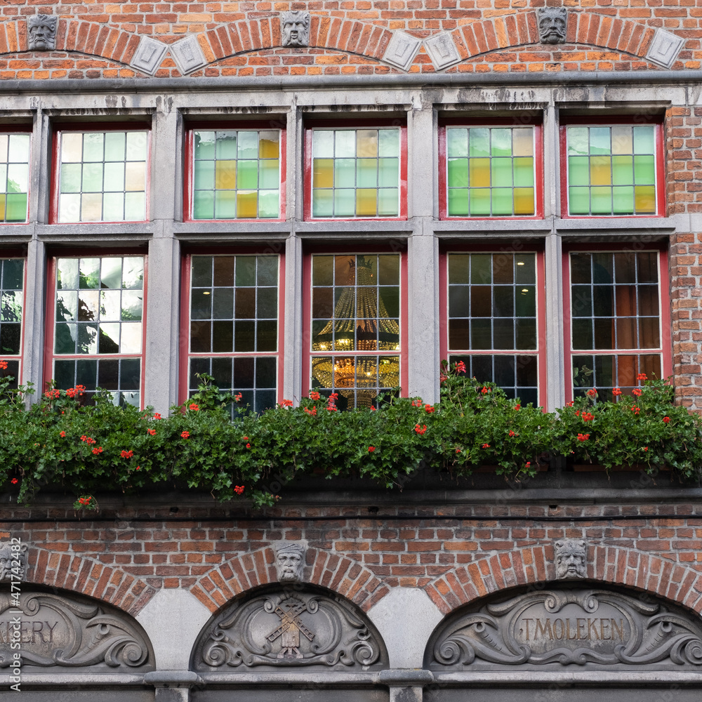 Nice windows and decoration of a building, in Bruges Stock Photo ...