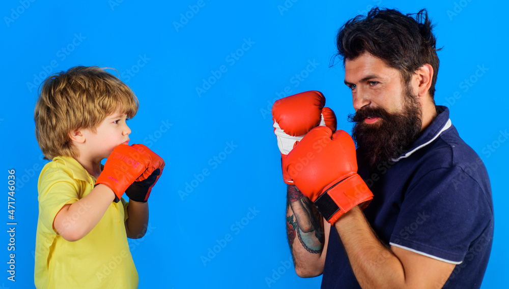 Child in boxing gloves training with coach. Trainer teaching boy ...