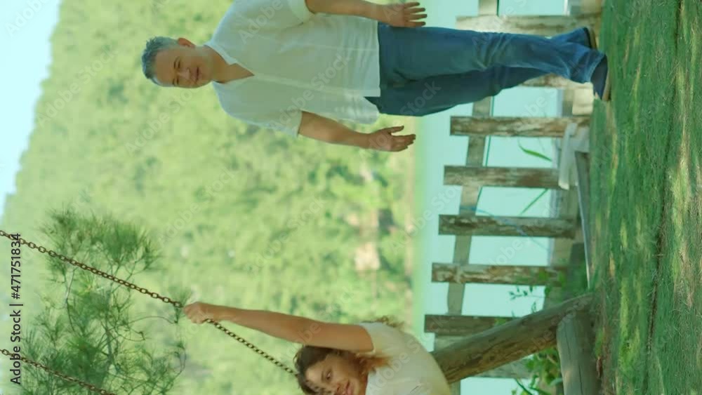 Vidéo Stock Cheerful husband rocking his wife in rocking chair.Happy ...