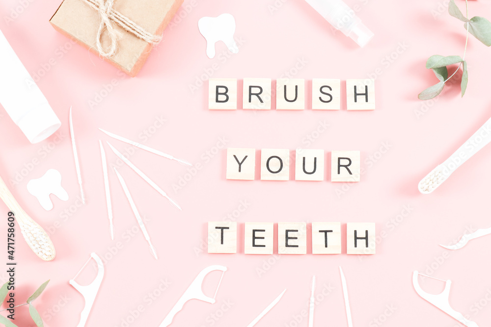 Bamboo toothbrush, dental floss, toothpicks, a tube of toothpaste ...