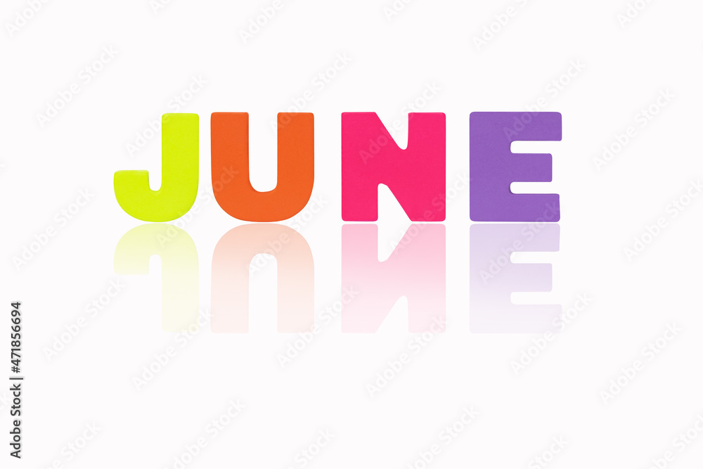 JUNE month English made of wood isolated on white background. Colorful ...
