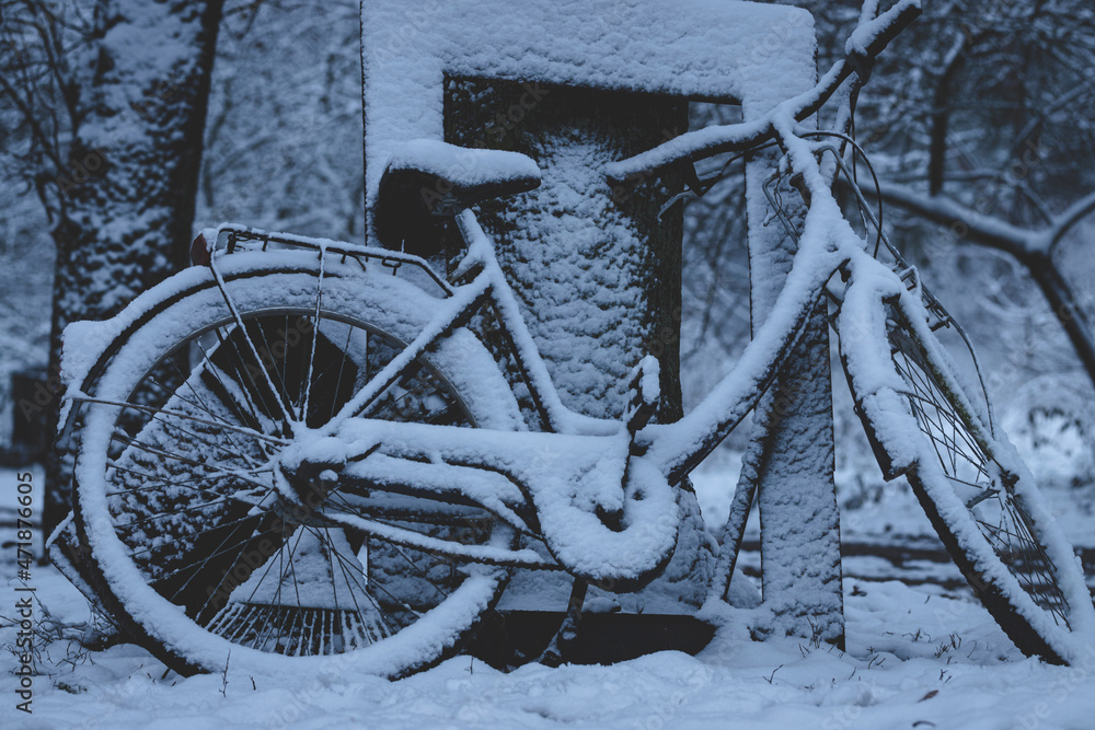 Bicycle under snow. Bike covered with lots of snow. Cold winter weather ...