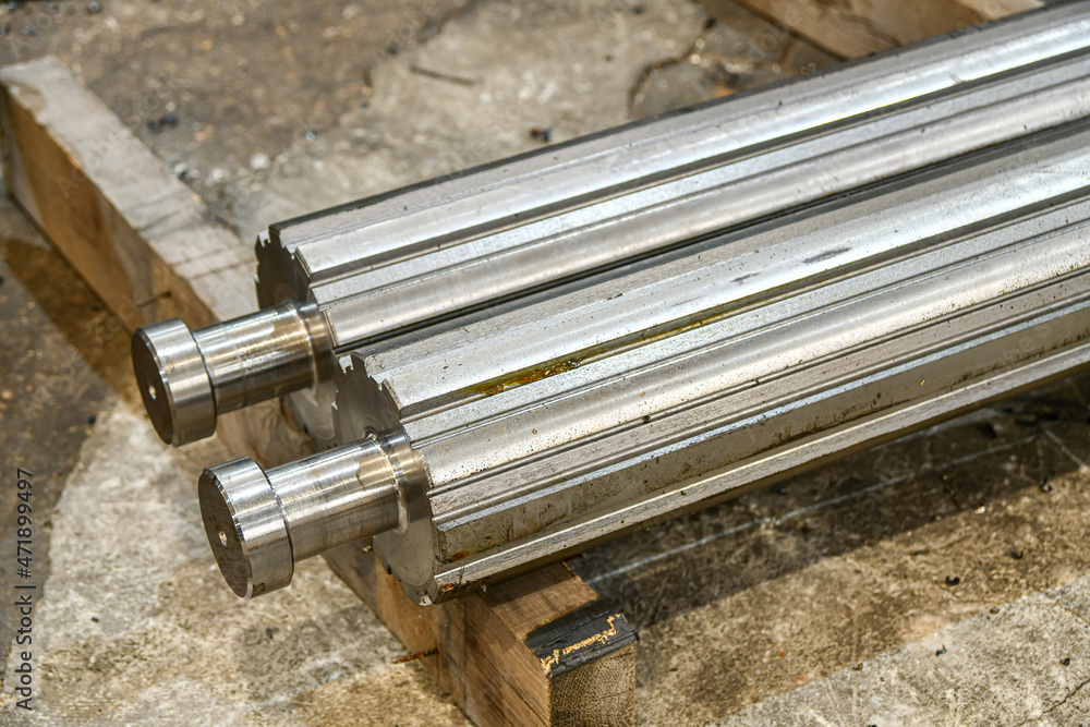 The spline shaft after CNC milling lies in the warehouse on a rack ...