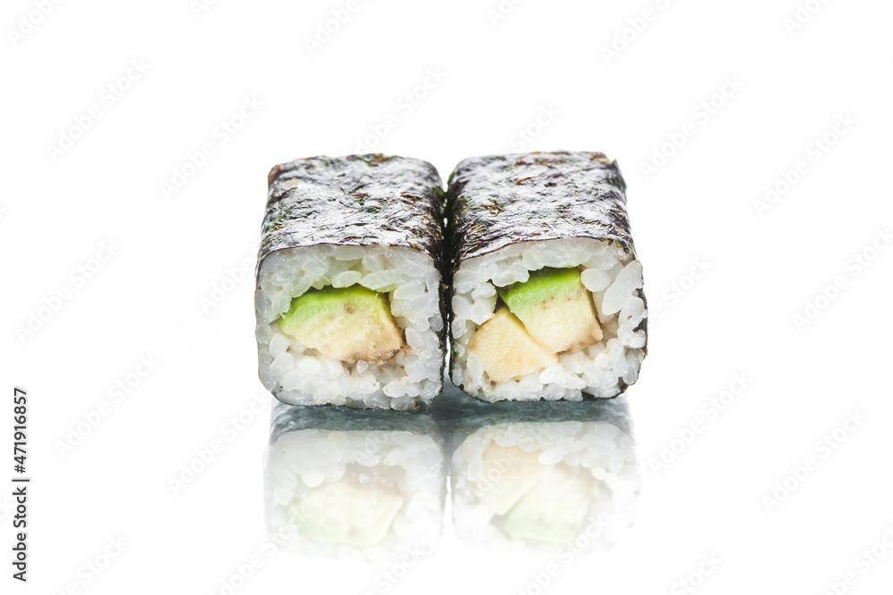 Two pieces of Japanese Vegan Maki sushi roll with nori seaweed on top ...