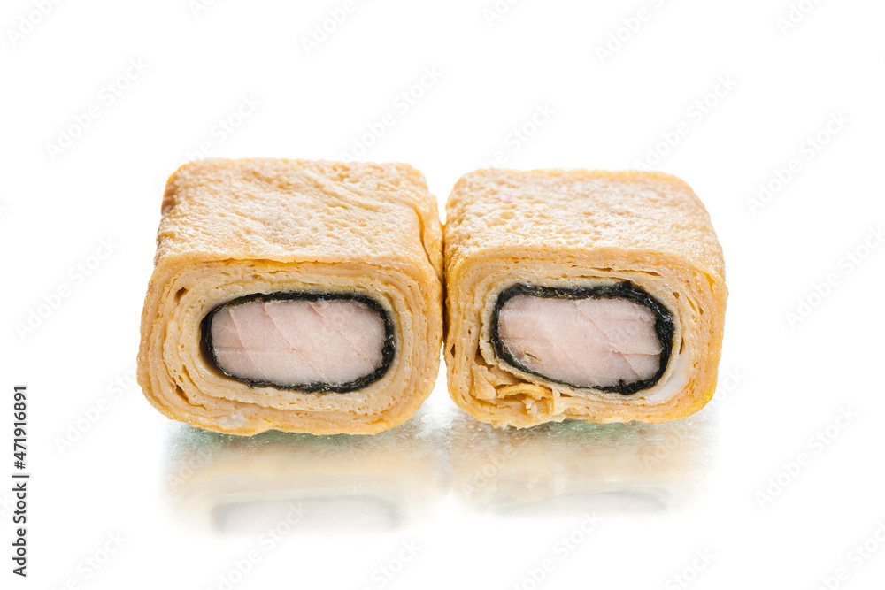 Two pieces of Japanese Tomago sushi roll with egg omelet on top. Tuna ...