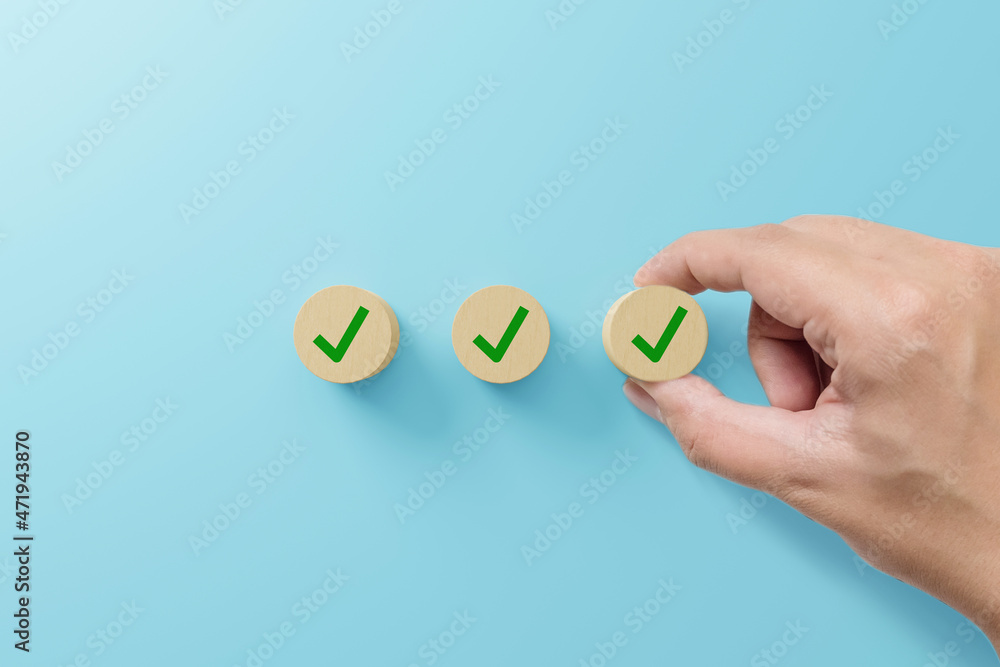 Checklist and check mark concept. Check mark on wooden blocks on light ...