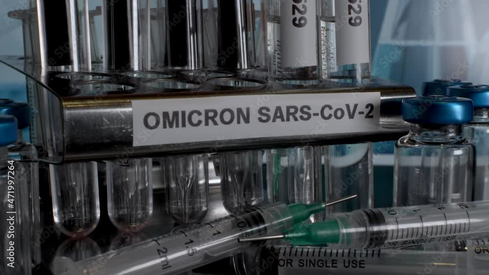 Close up dolly shot of medical equipment labelled with Omicron SARS-CoV ...