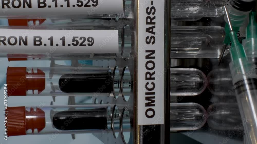 An extreme close up vertical video of glass test tubes containing ...