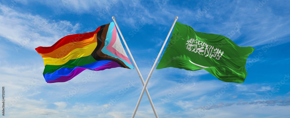 crossed flags of progress lgbt pride and Saudi Arabia flag waving in ...