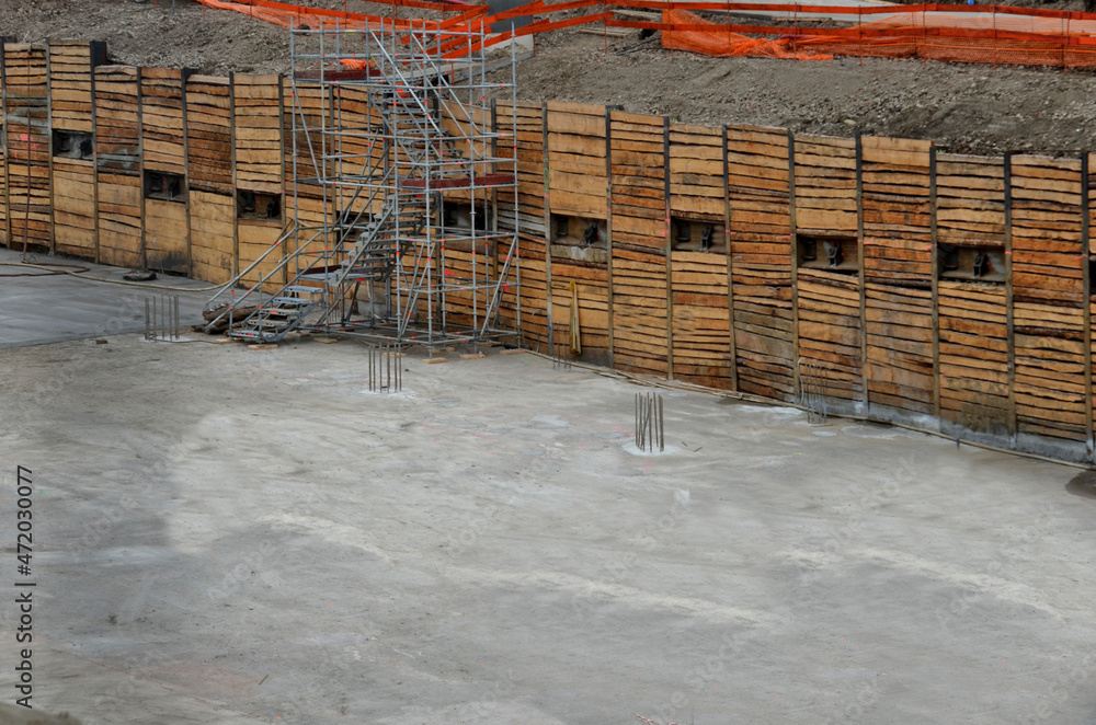 construction pit where underground garages are being built. wooden ...