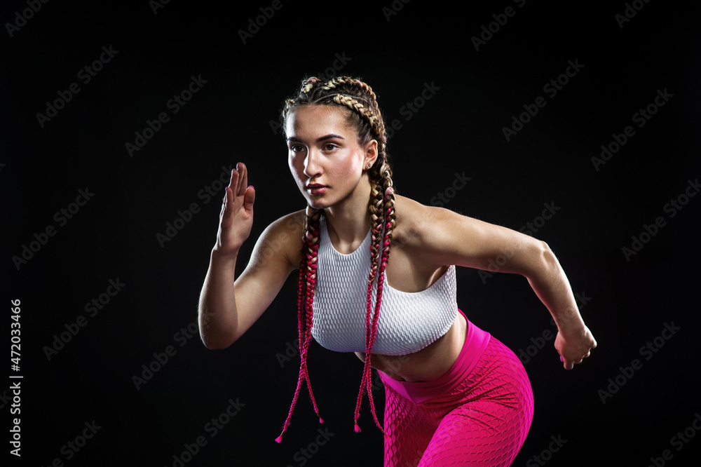 Aduld fit girl in the sportswear, woman sprinter, running on black ...