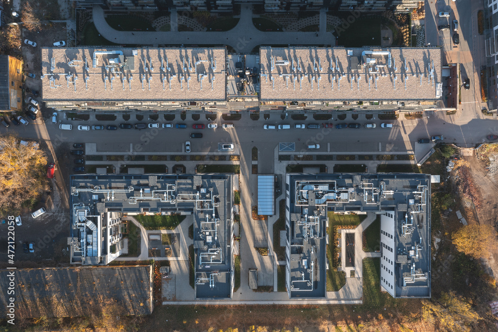 Top view of the roofs of multi-storey buildings, many ventilation pipes ...