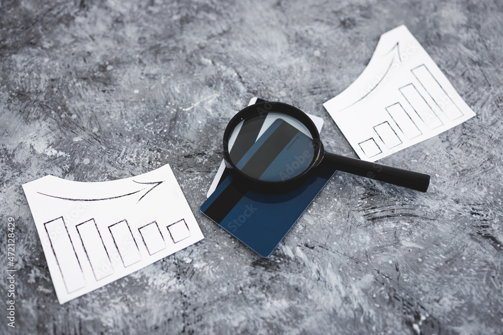 financial markets or money and investments, payment cards with charts ...