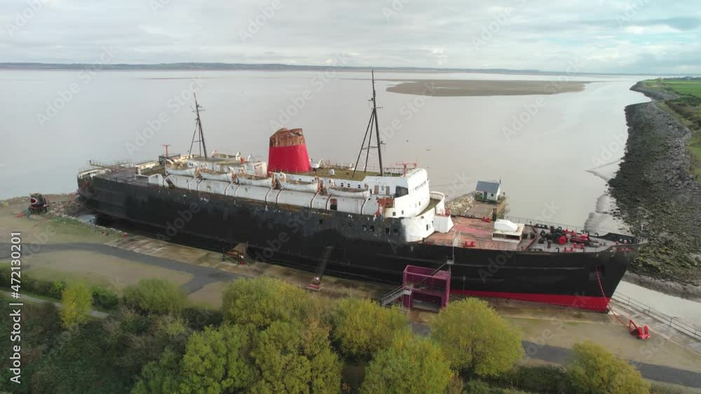Decaying rusty TSS Duke of Lancaster ship, aerial fly forward view ...