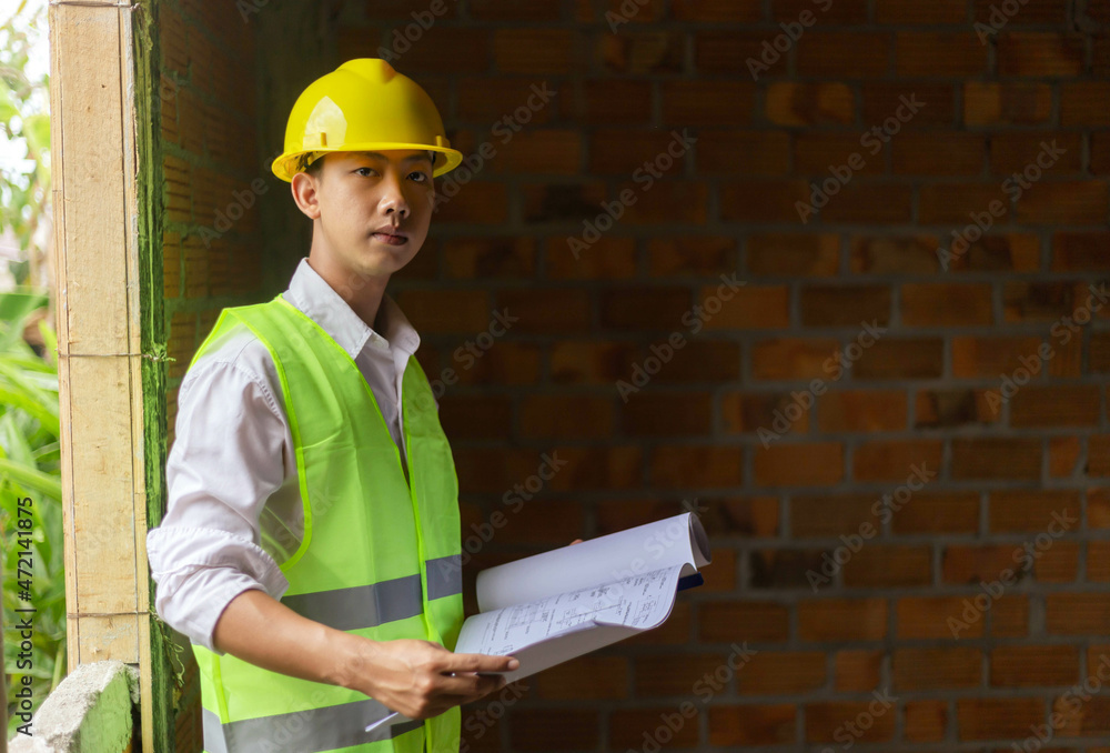 engineer concept The male head builder leaning himself at the window ...