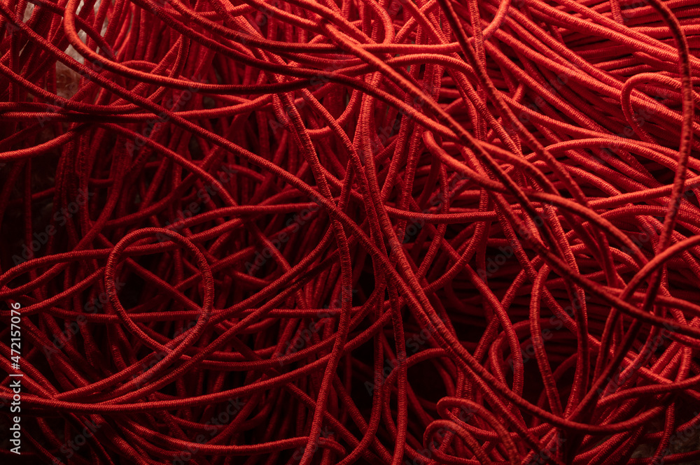 Chaotic interlacing of red rope. Abstract geometric background pattern ...