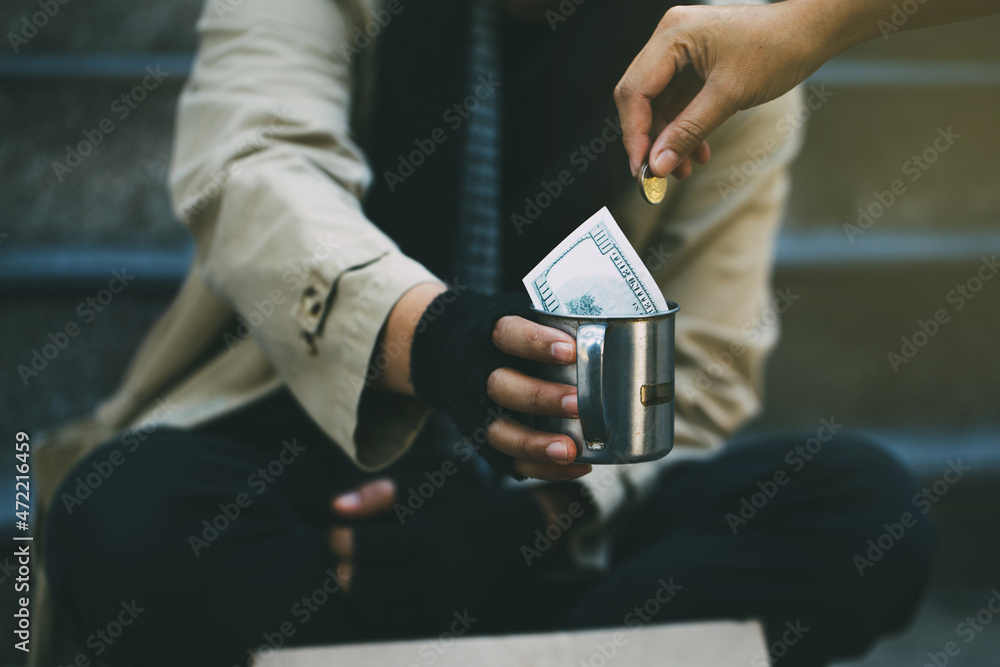 People Giving Money To The Poor
