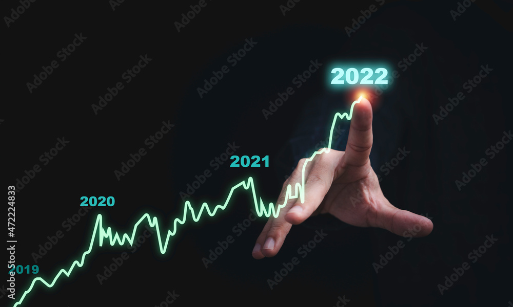 Businessman drawing virtual technical graph and chart for analysis ...