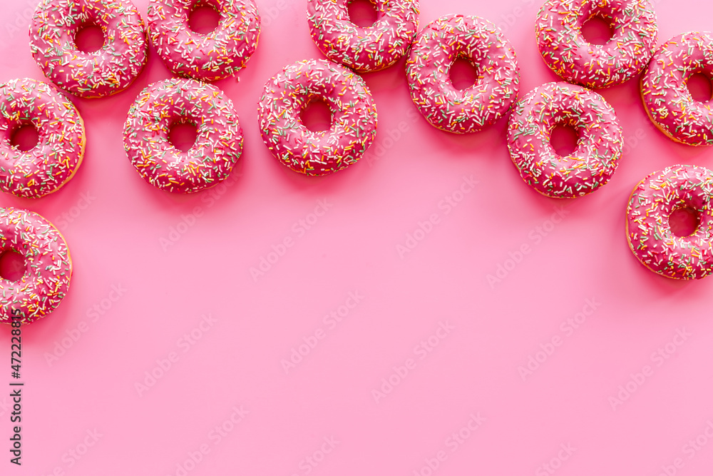 Pink donuts with sprinkles set, top view. Sweet bakery background Stock ...