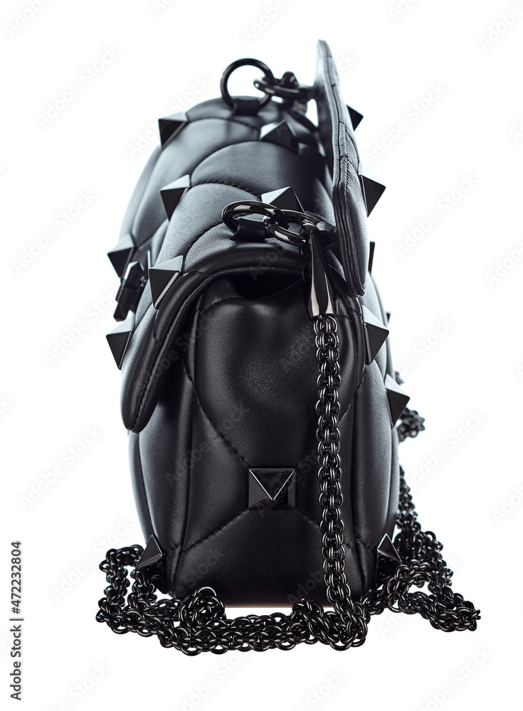 Handbag made of genuine leather in black color, decorated with chains and rivets in the shape of ...