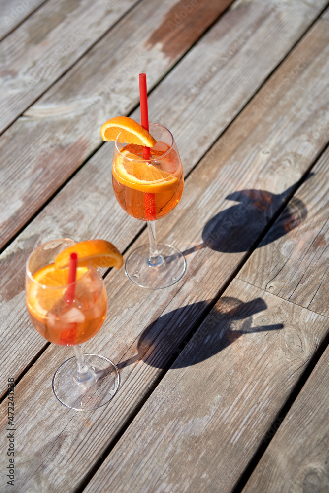 Aperol spritz cocktails on summer party by the pool, copy space. Event ...