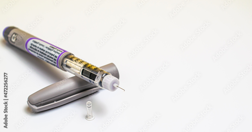 Insulin pen injector. Insulin pen fill with needle on white background ...