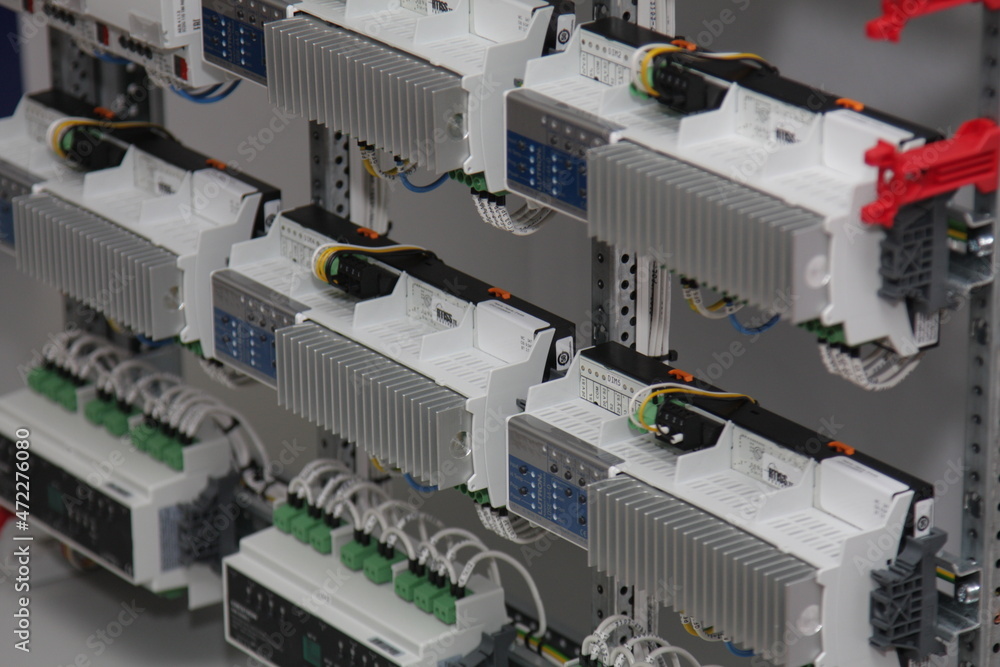 Lutron modules for voltage dimming are connected by a mounting wire and ...