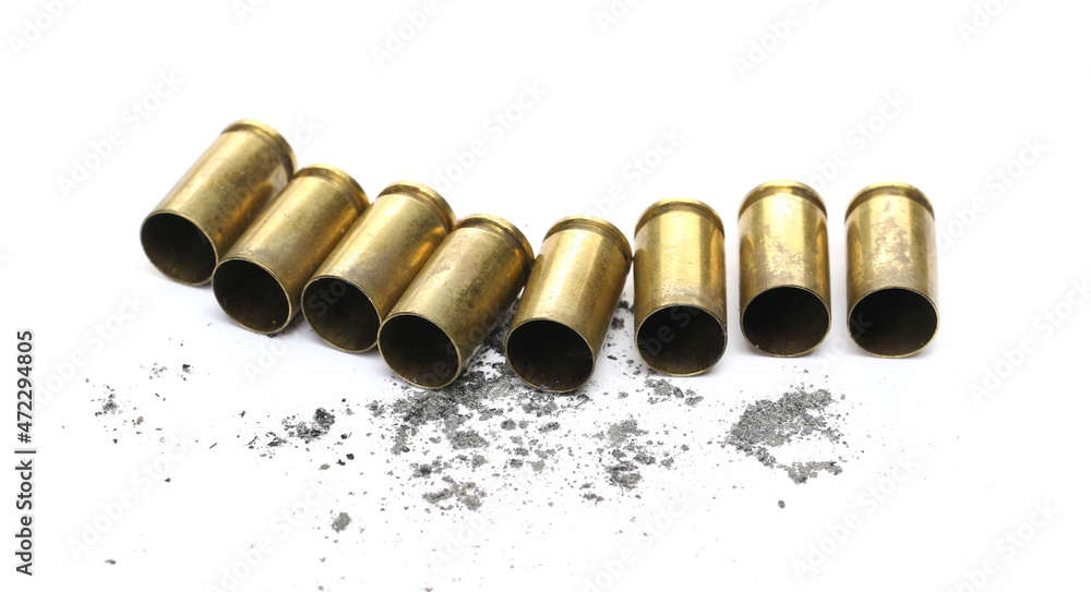 9mm pistol bullet casings with gunpowder pile isolated on white ...