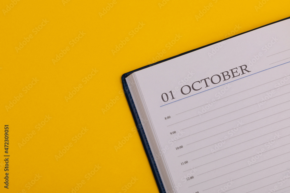 Notepad or diary with the exact date on a yellow background. Calendar ...
