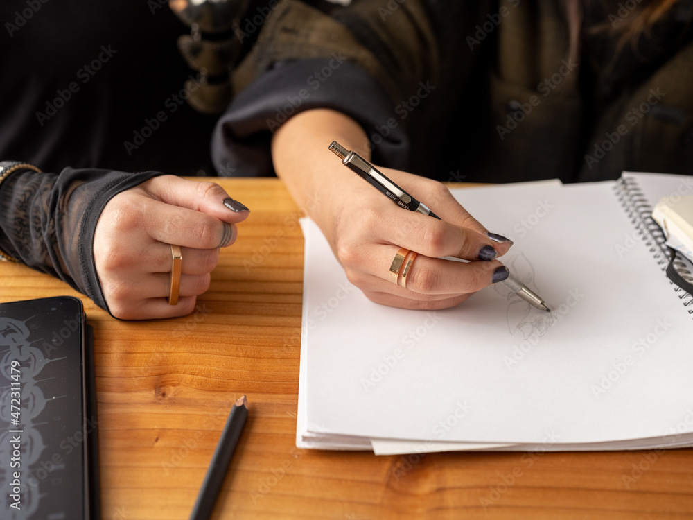 Non binary artist and non-binary student drawing indoors Stock Photo ...