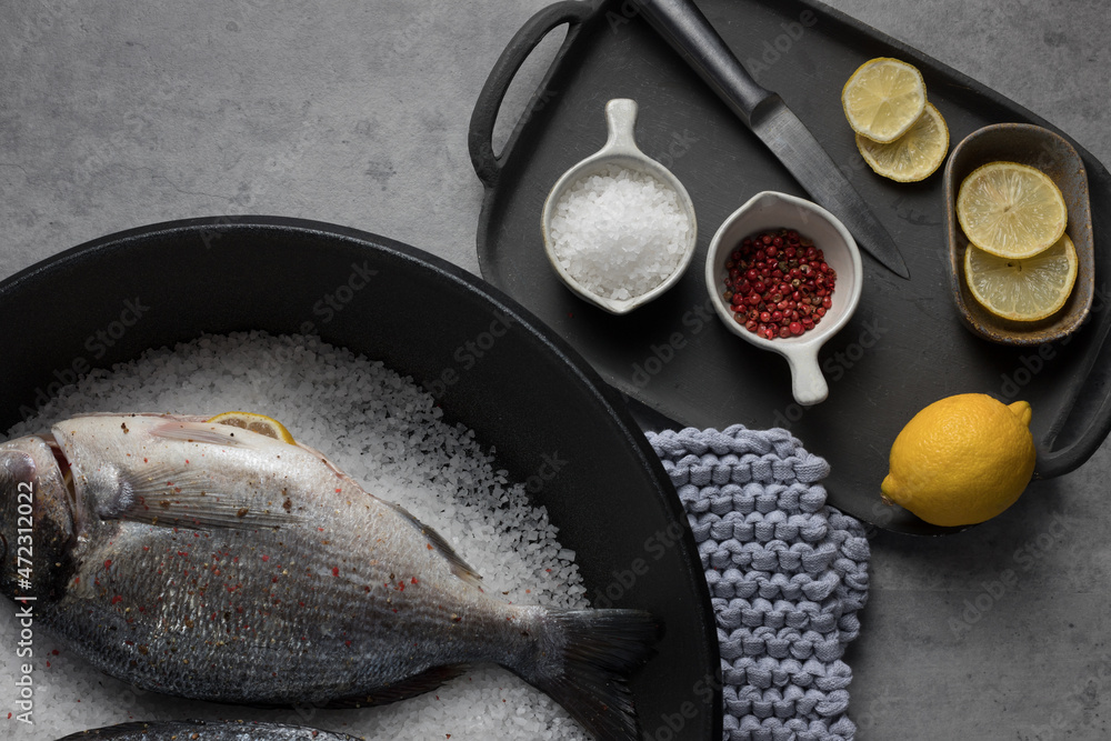 Ingredients for preparing a sea bream in a rock salt crust. Stock Photo ...