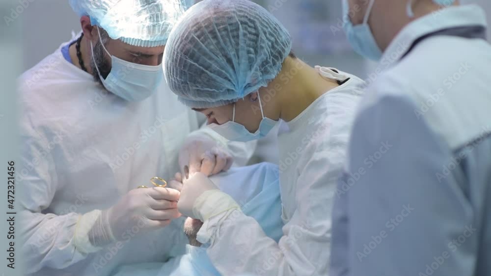 Vídeo do Stock: Surgeon and nurse during a dental operation ...