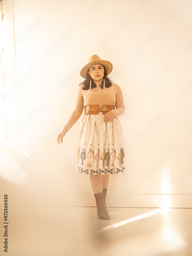 Young Indigenous female model indoors Stock Photo | Adobe Stock
