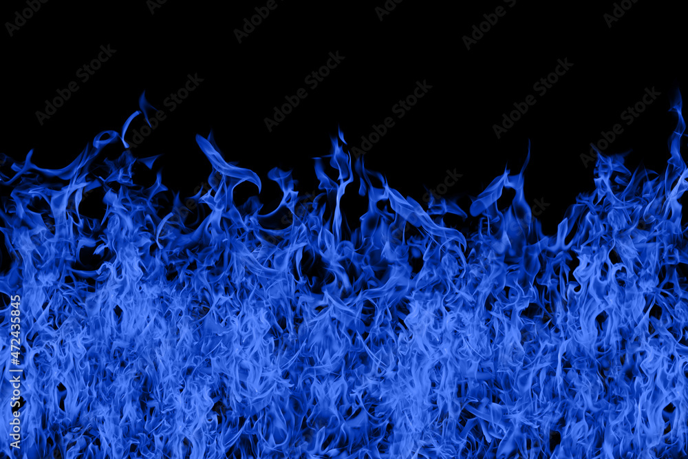 Violently burning blue flames on a black background. Stock Photo ...