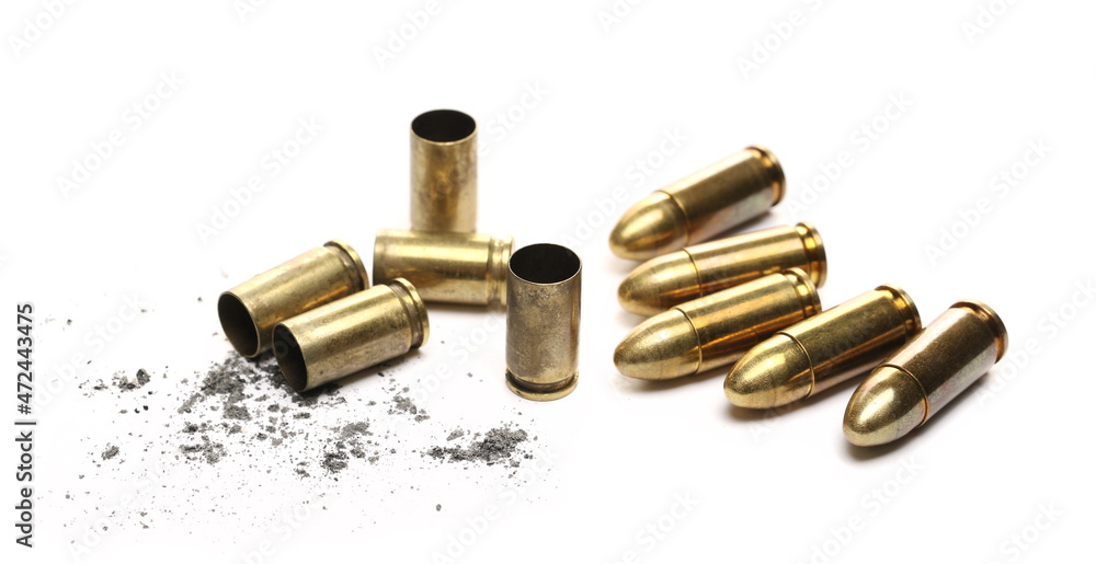 9mm pistol bullet casings with gunpowder pile isolated on white ...