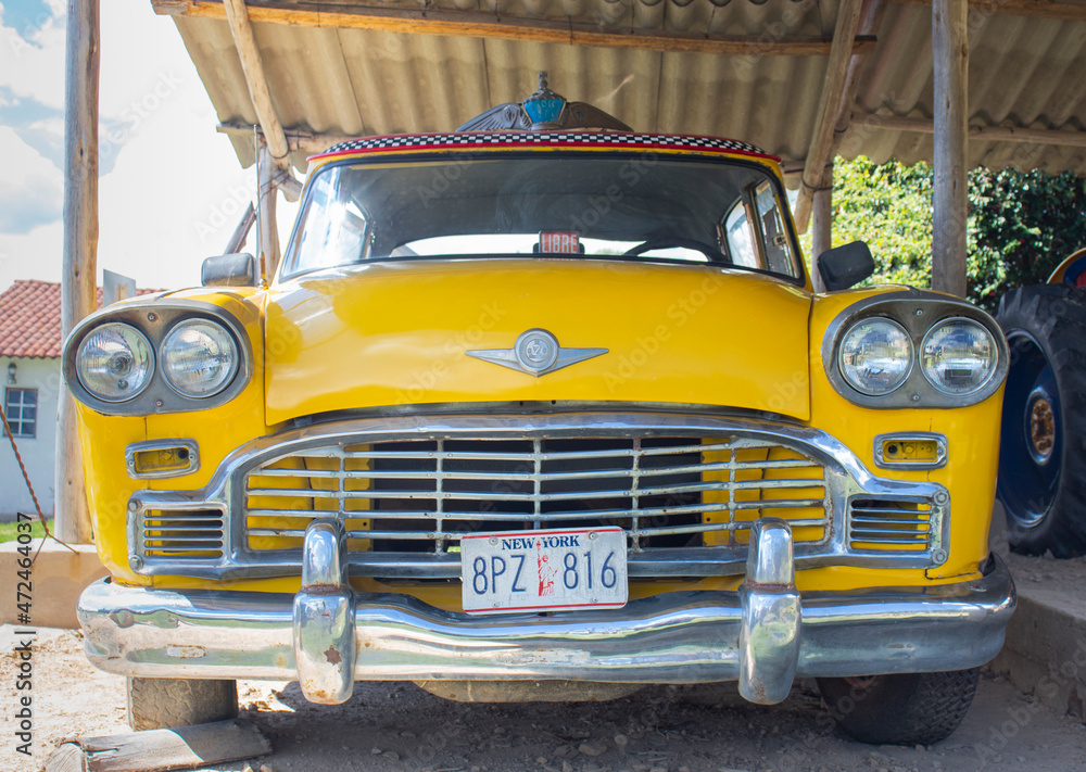 front of a Classic Chevrolet Taxi with new york License Plate in sunny ...