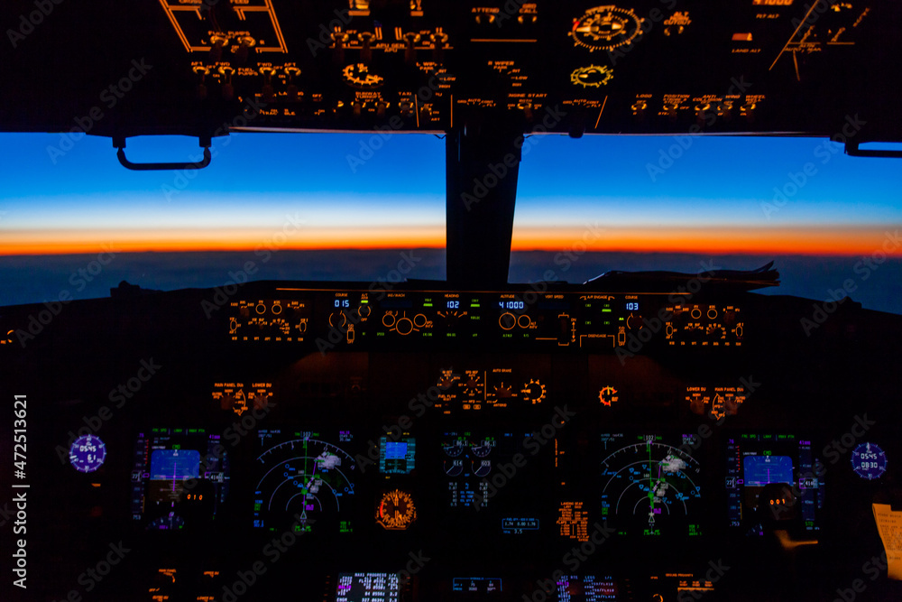 Cockpit view of sunset from Boeing 737 over Greenland at 41000 feet ...