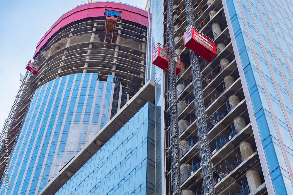 Skyscraper construction. Construction site. Multi-storey buildings with ...
